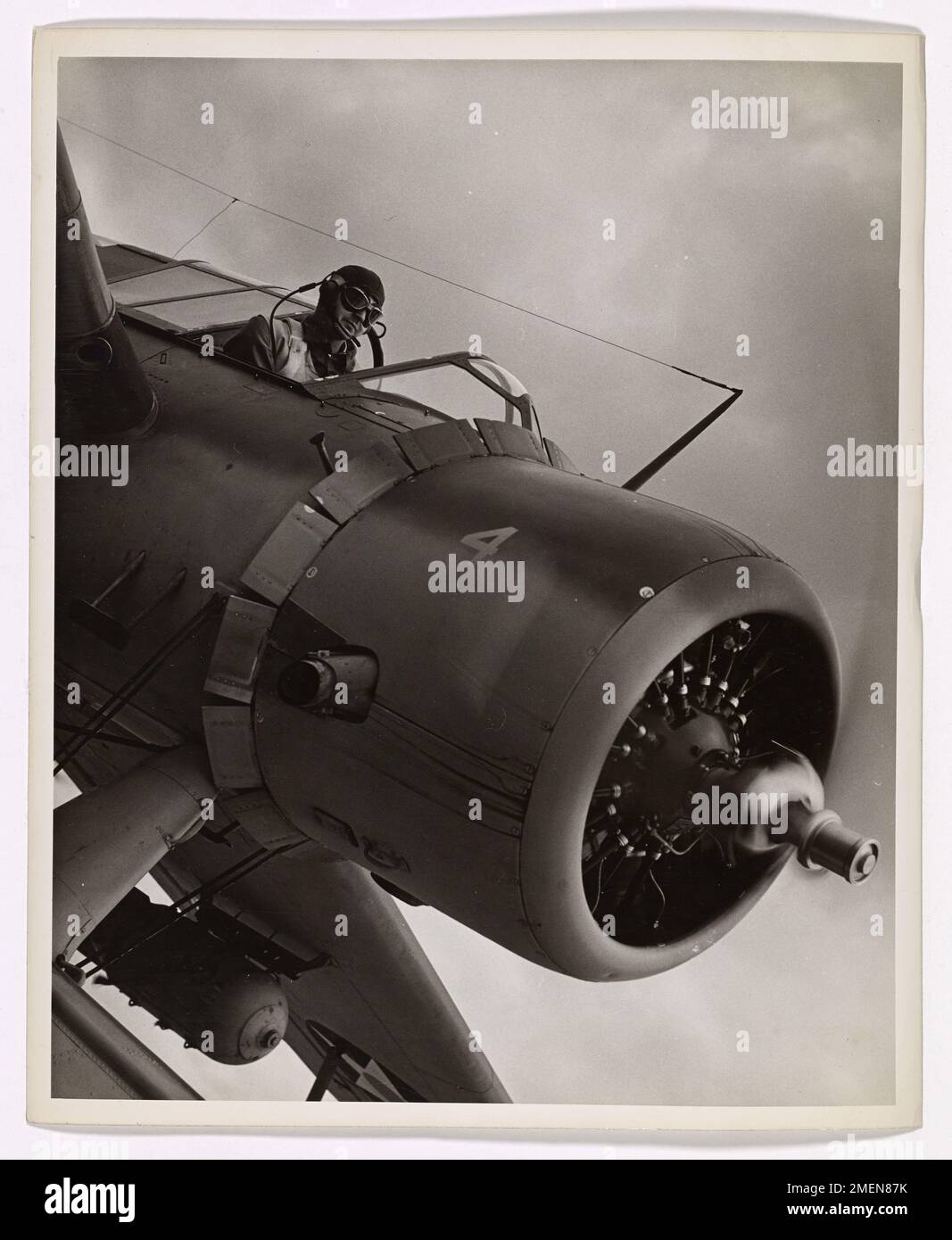 A Coast Guard Sea Bird aircraft and its pilot are shown preparing for a ...