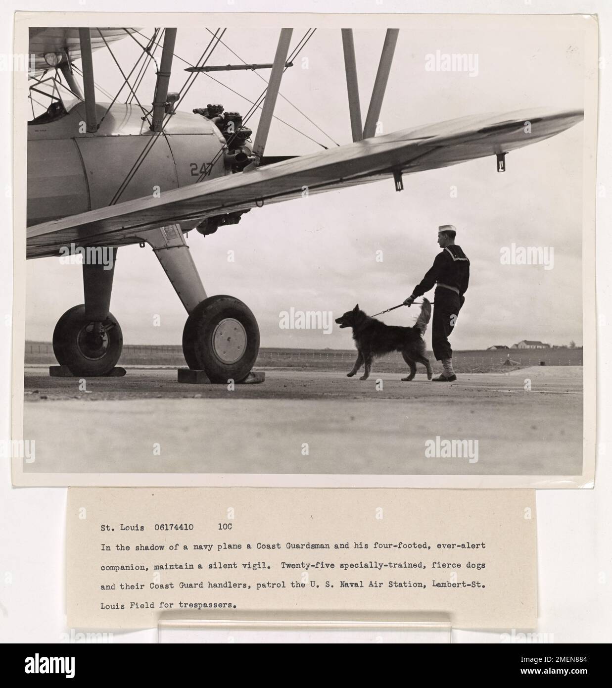 A Coast Guardsman and his dog patrol the U.S. Naval Air Station at ...