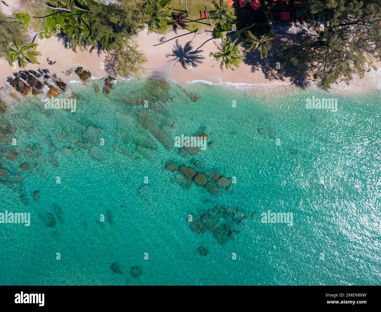 A top view of the sandy Ao Tapao beach in Koh Kood, Thailand with blue ...