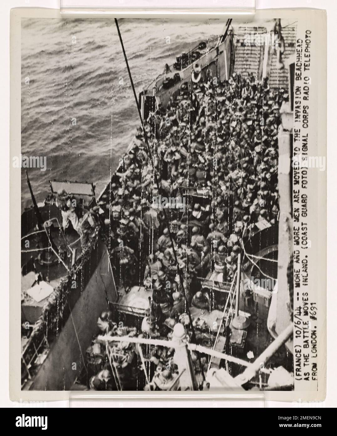 Packed with fighting men and military vehicles, a Landing Craft Tank ...