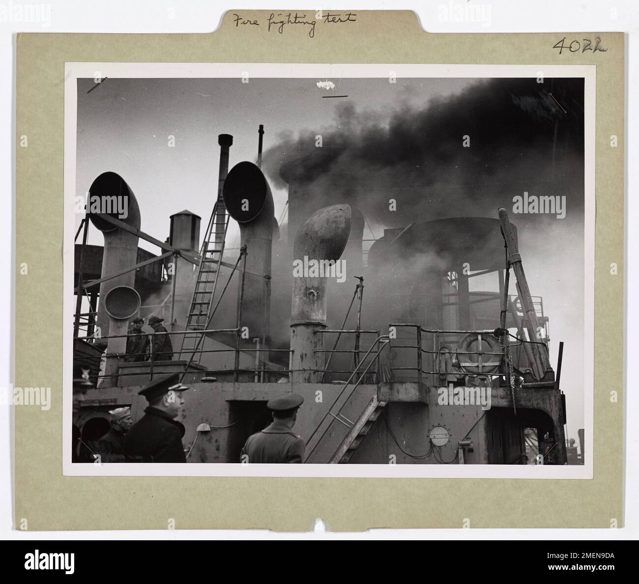 Liberty Ship Aflame in Fire Fighting Test. This image depicts smoke ...