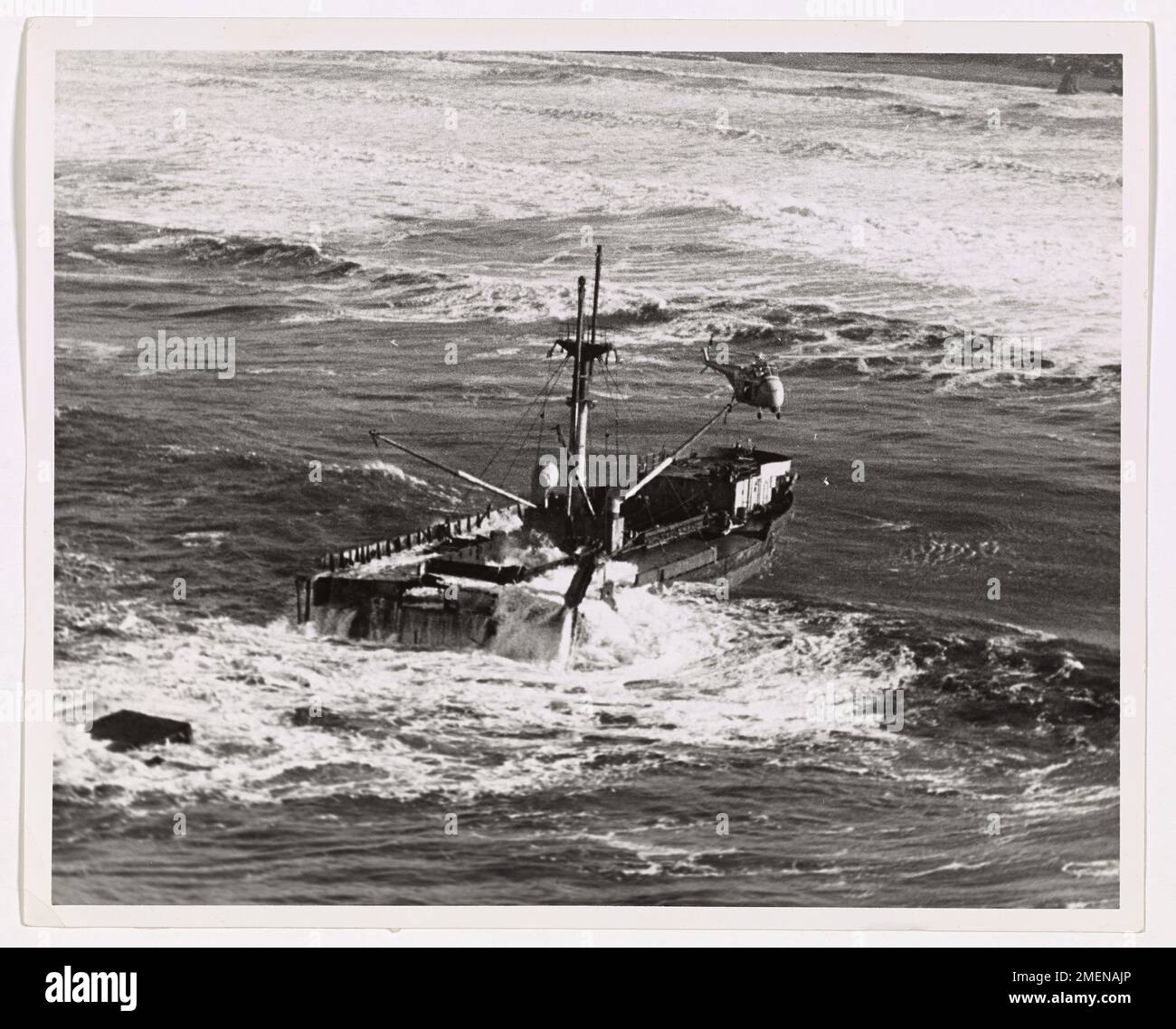 A Coast Guard helicopter is seen recovering salvage from the wrecked ...