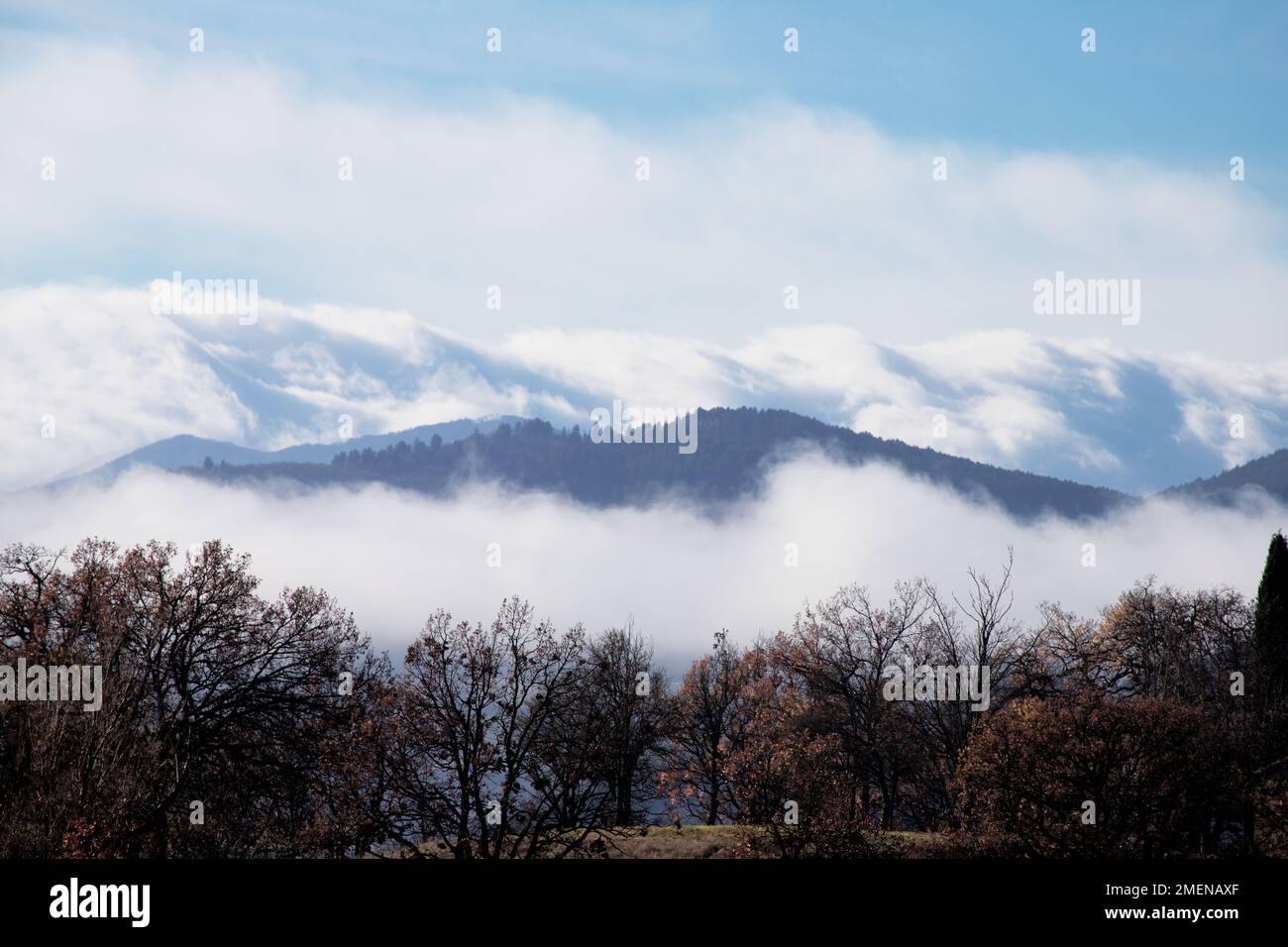 Misty mountain range shrouded in hi-res stock photography and images ...