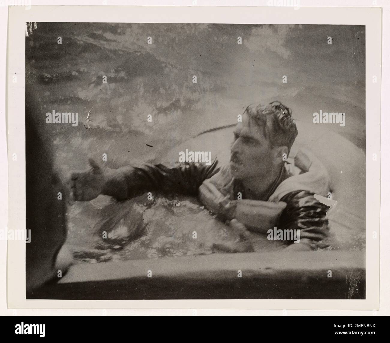 Photograph Of Man Being Rescued From The Sea This Image Depicts A