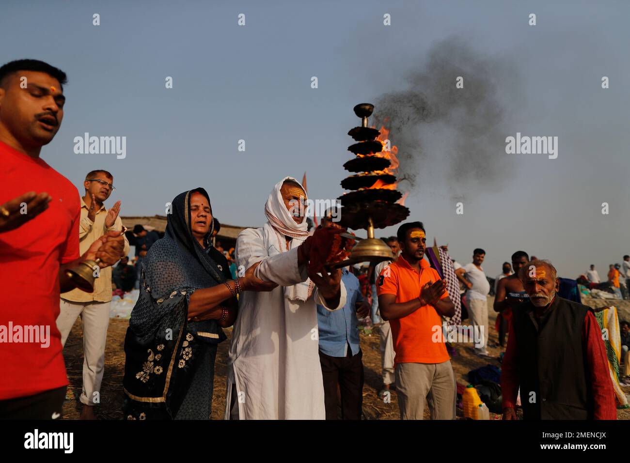 Hindu devotees perform morning rituals at Sangam, the confluence of the ...