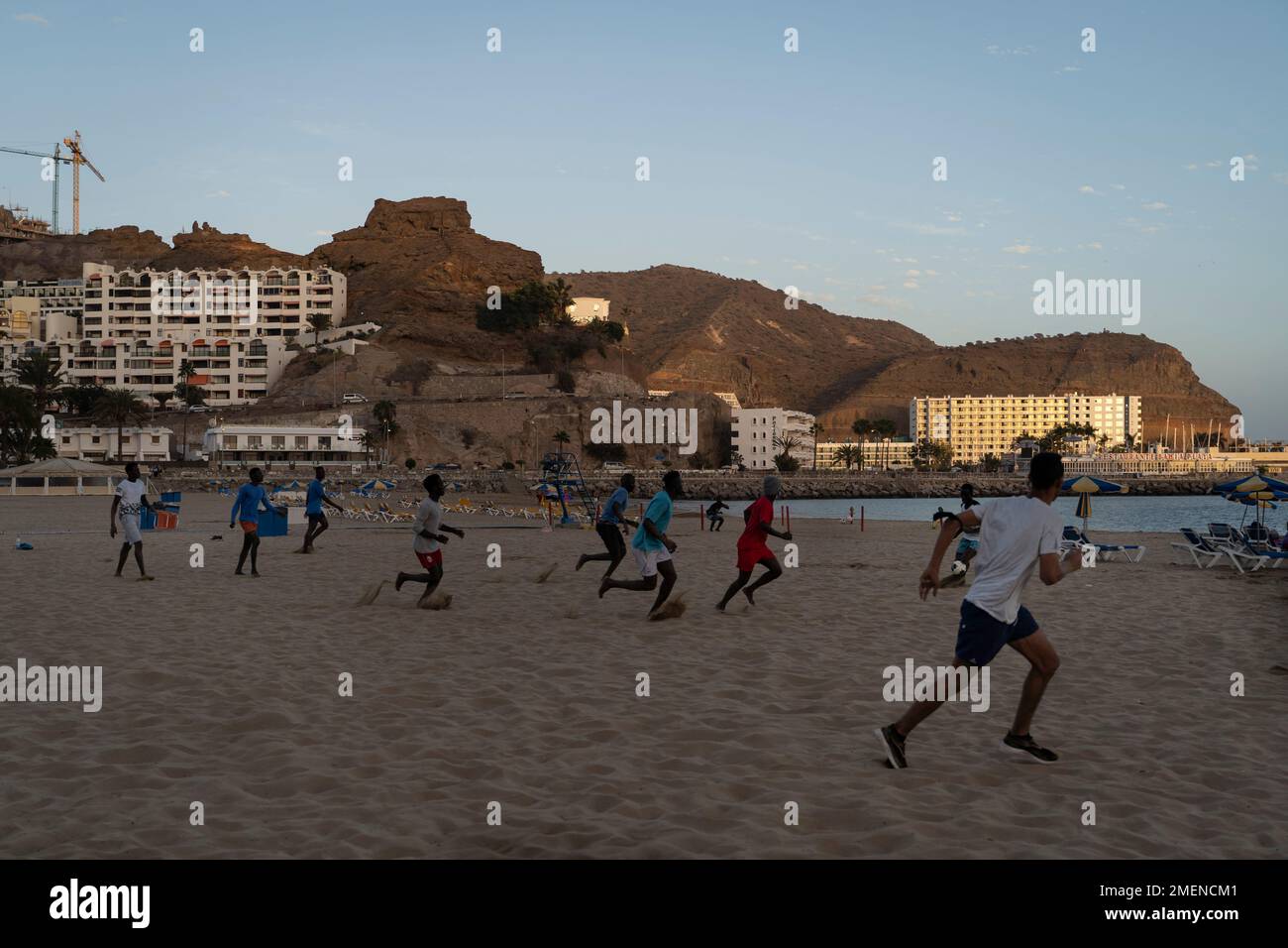 Migrants, mostly from Senegal, play soccer on the beach in Puerto Rico ...