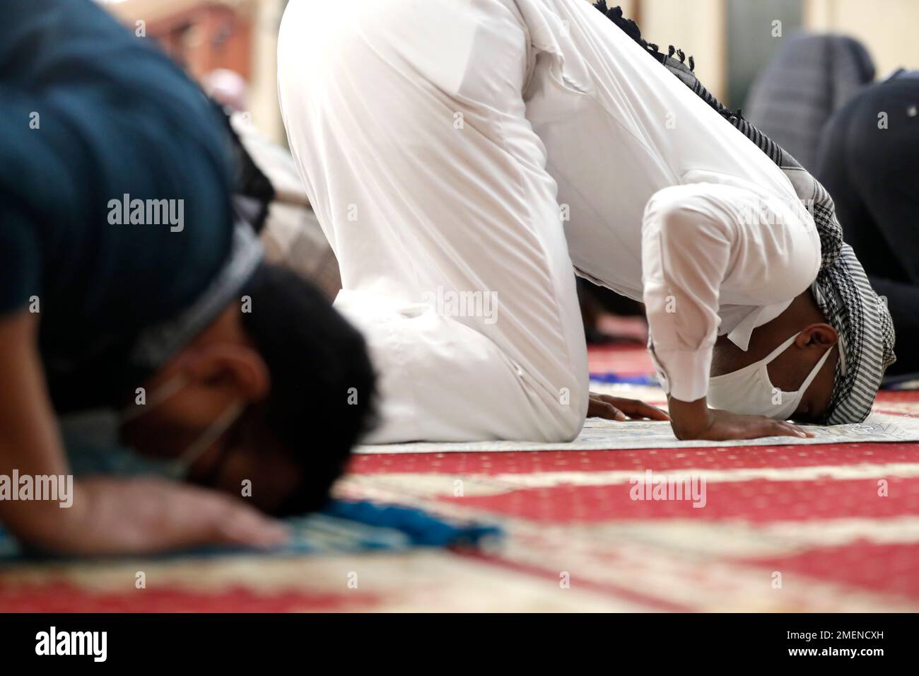 A Muslim bows in Sijdah during an evening prayer called "tarawih ...
