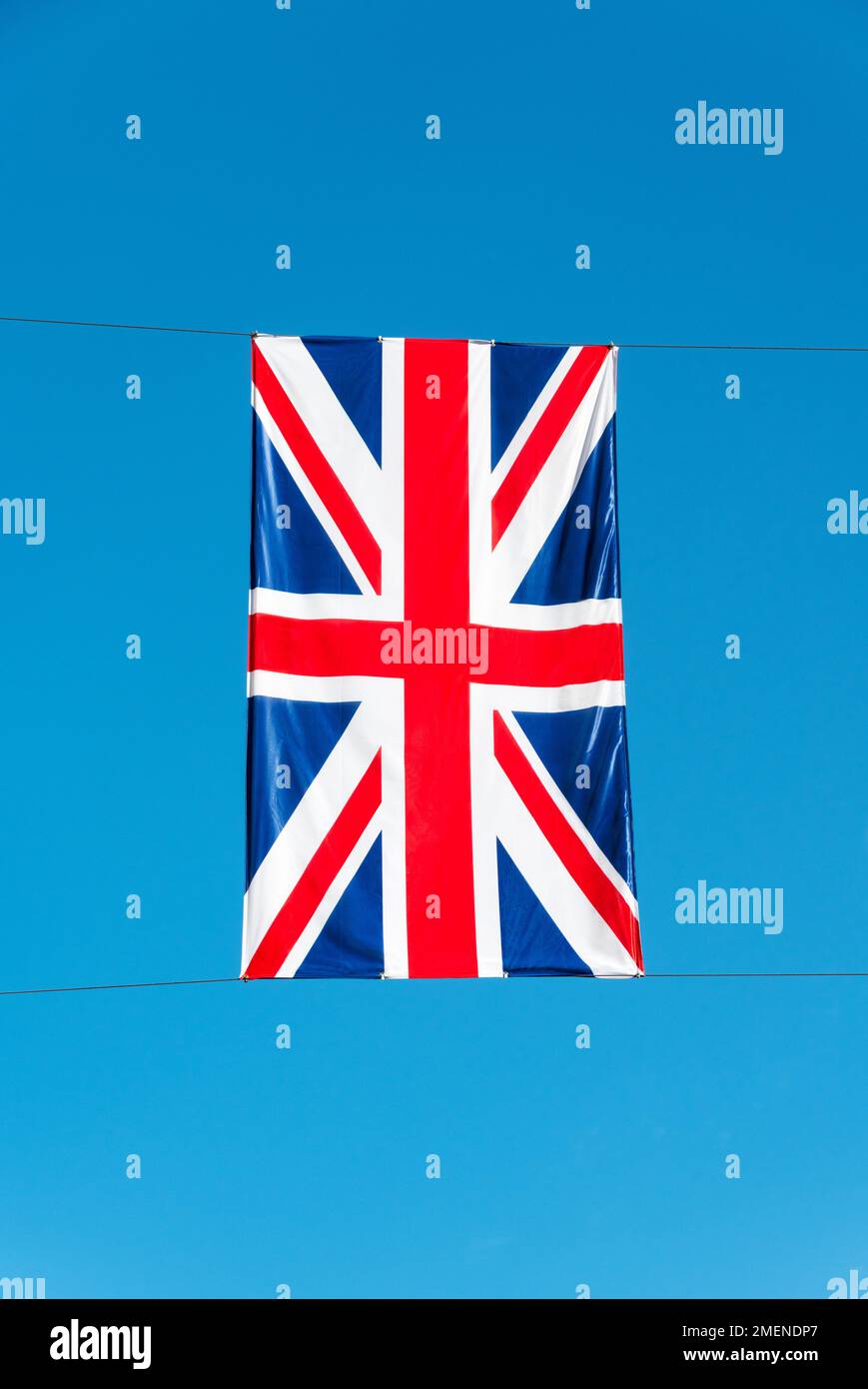 Union Jack flag against blue sky, London, England Stock Photo - Alamy