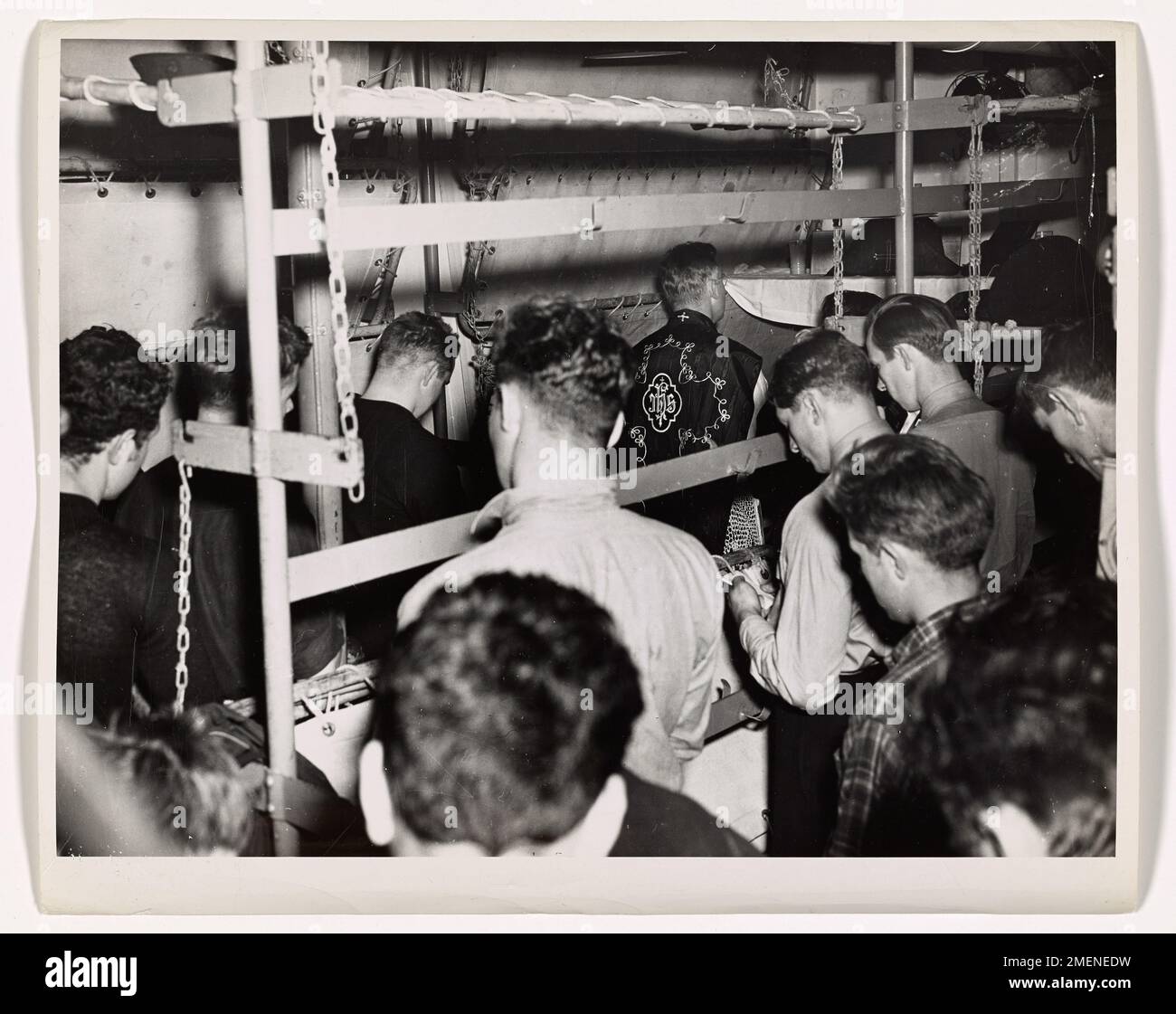 American soldiers attend Mass aboard a Coast Guard-manned Infantry ...