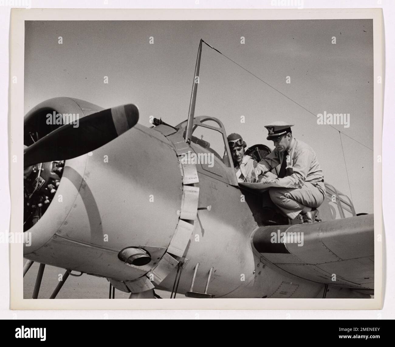 A Coast Guard pilot receives final orders regarding enemy submarine ...