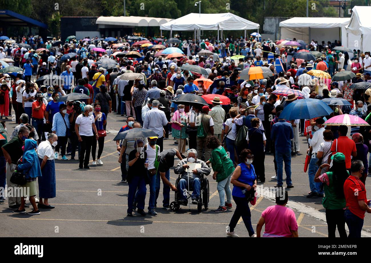 Hundreds of persons over 60-years-old, line up to be vaccinated with ...