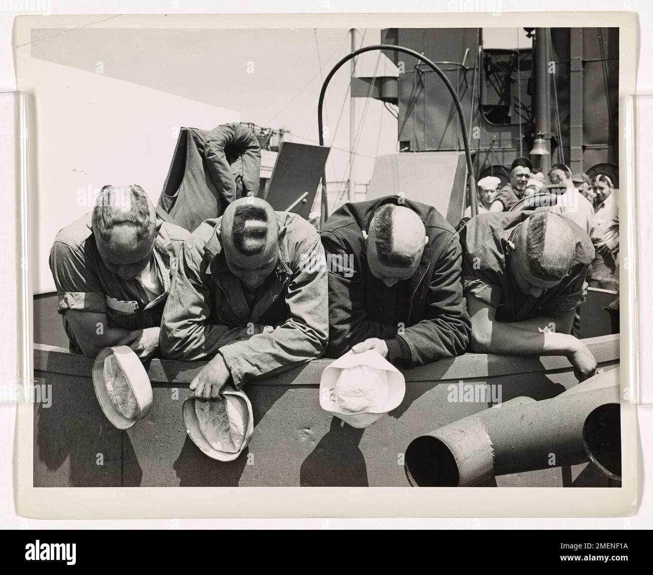 Four Coast Guardsmen serving as scouts on an LCM to the French invasion ...