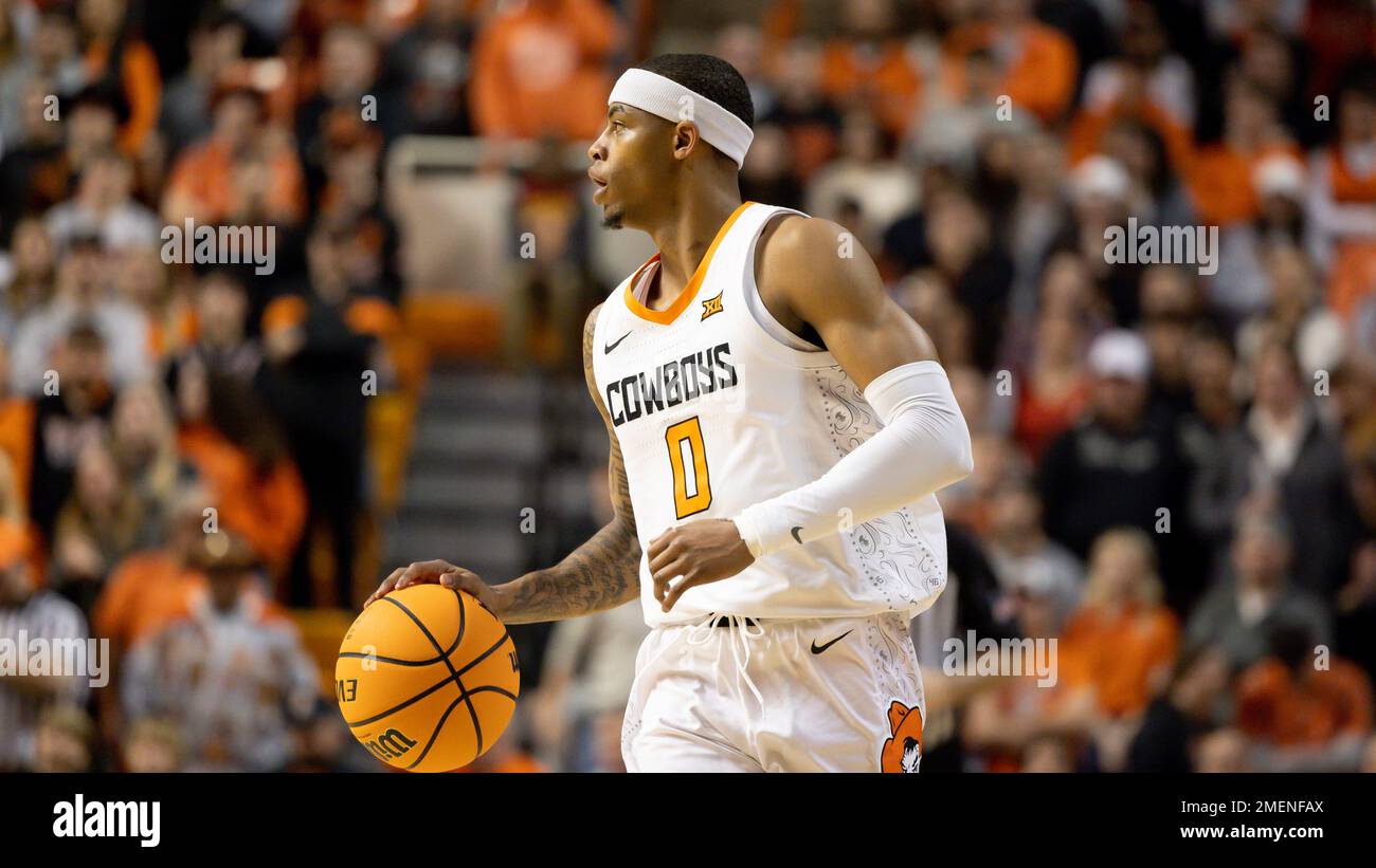 Oklahoma State's Avery Anderson III (0) brings the ball up the court in the first half of the ...