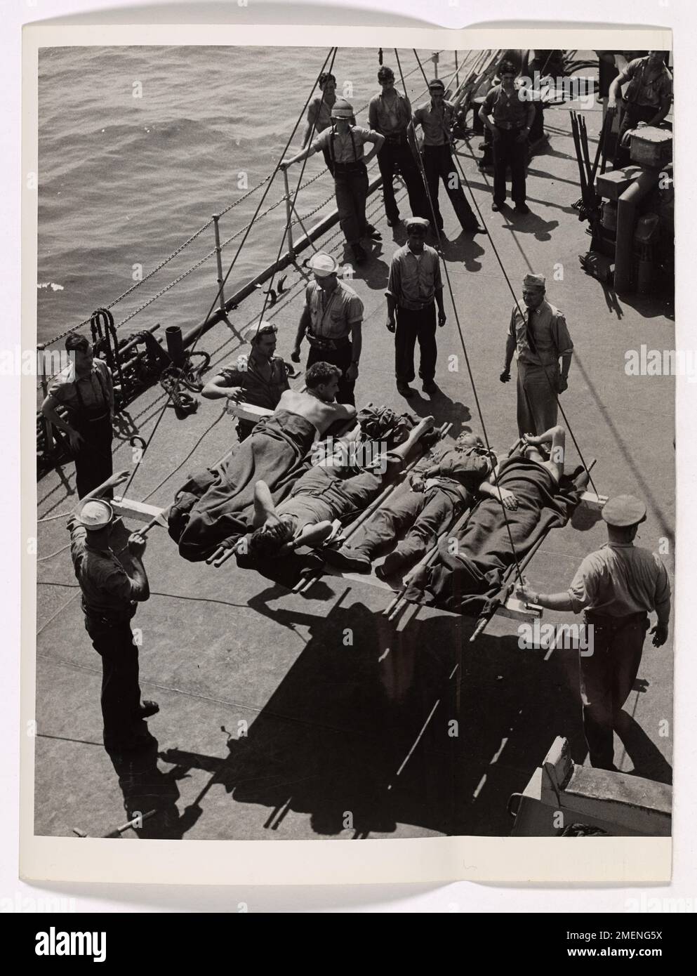 Wounded soldiers are seen being transported to on-board hospitals for ...