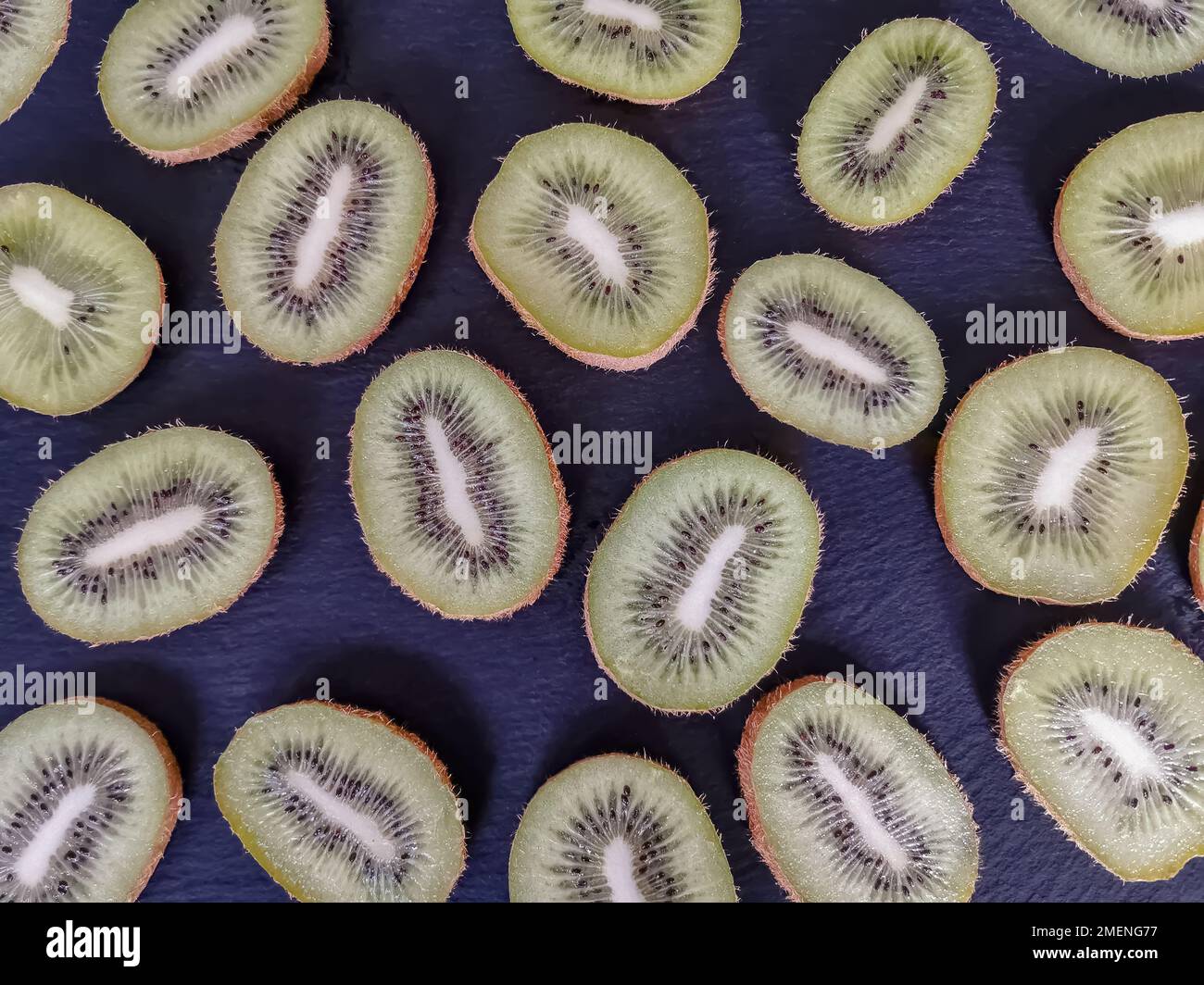 Background pattern view with various sliced kiwis, interior of the ...