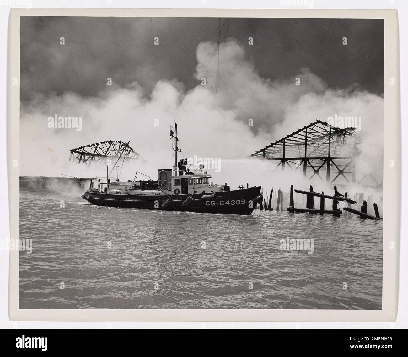 A Coast Guard Fireboat combats a dock fire at Texas City, showcasing ...