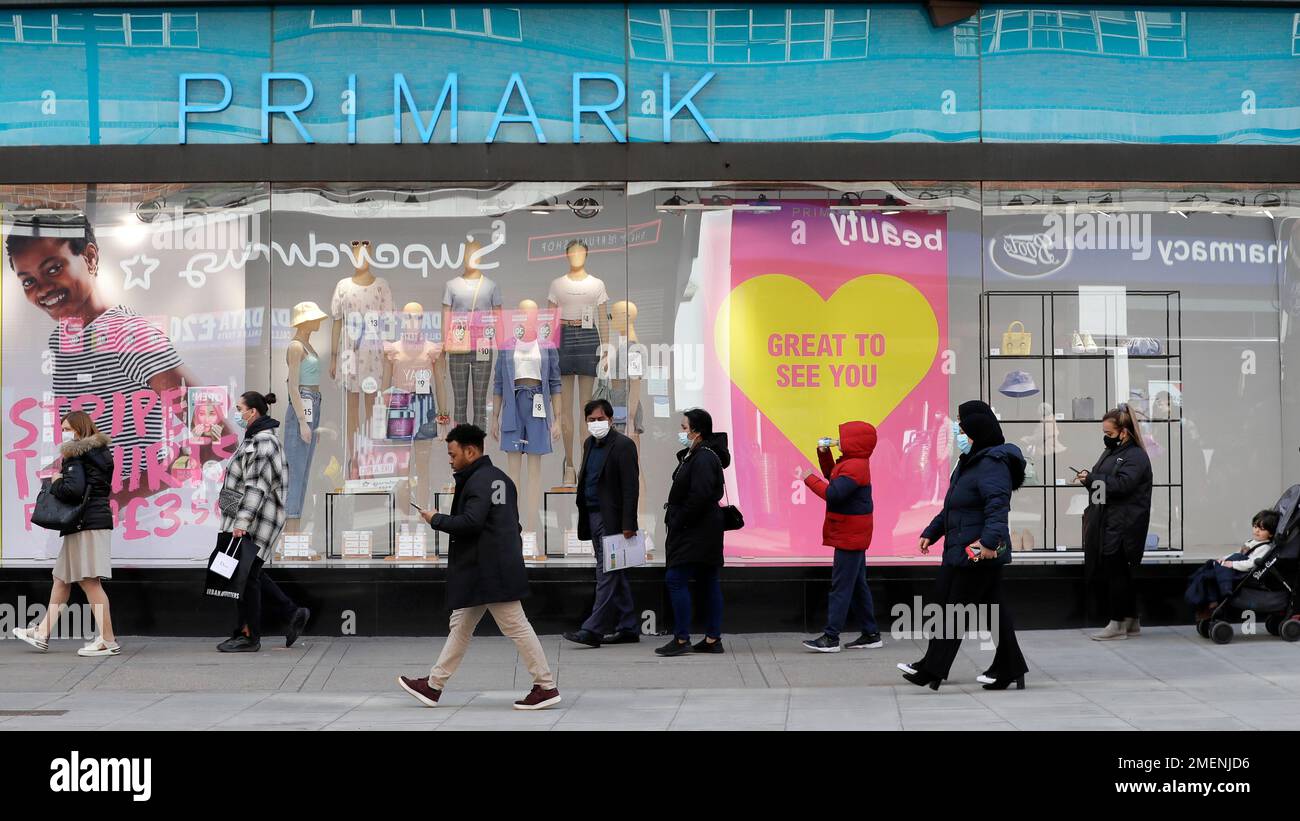 People queue to get into Primark store on Oxford Street in London ...