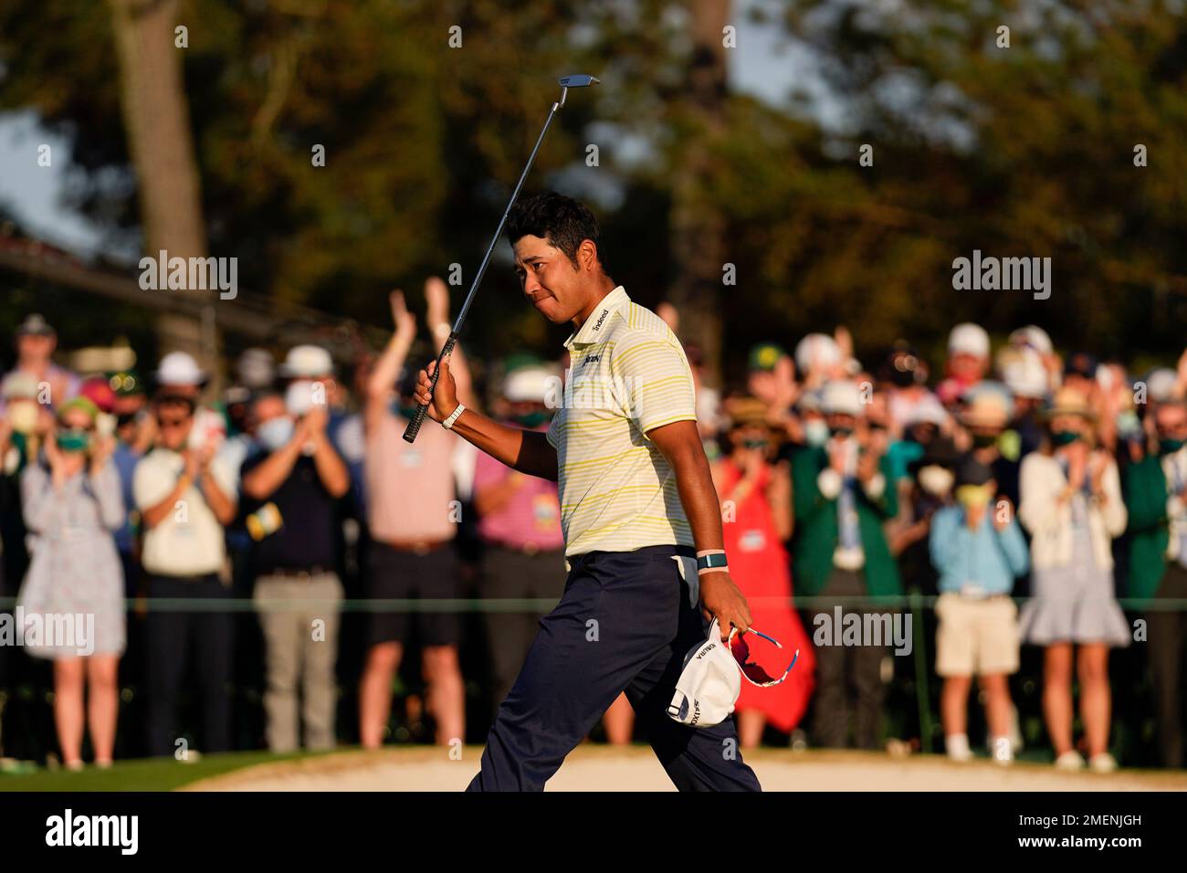 Hideki Matsuyama, of Japan, waves after winning the Masters golf ...