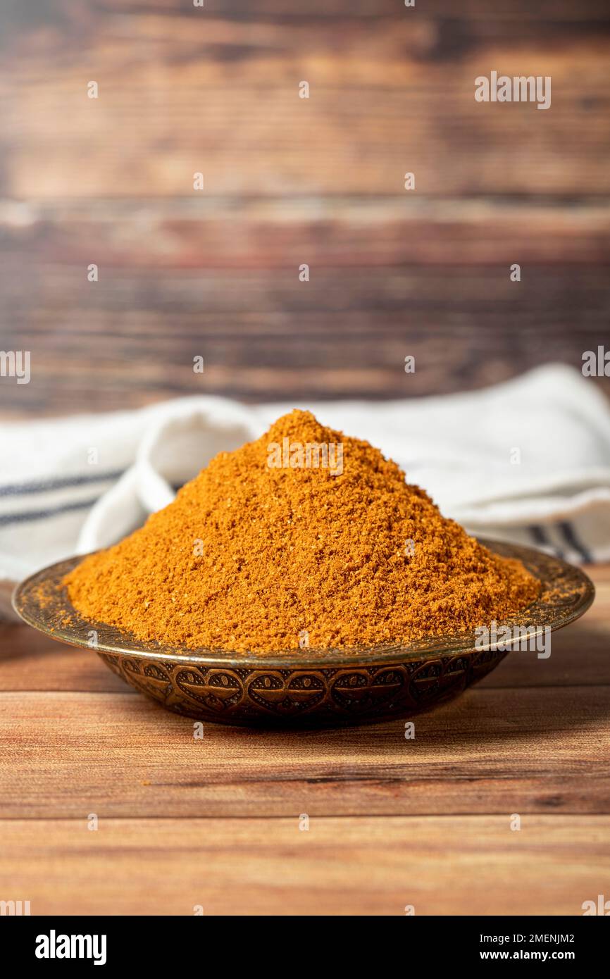 Meatball spice in bowl on rustic table. Meatball seasoning is a spice ...