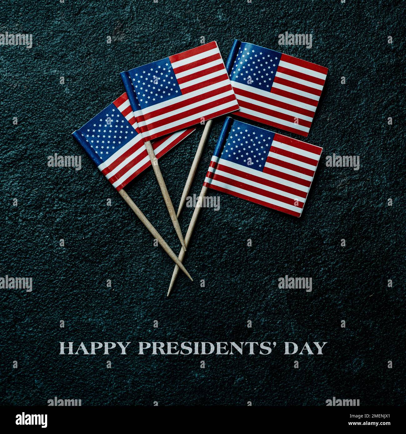 text presidents day and a flag of the united states of america lying on ...