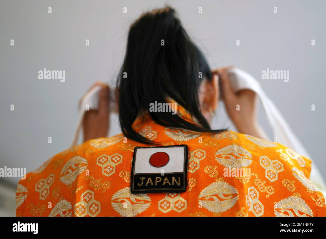 Olympic super-fan Kyoko Ishikawa wears a cheering headband with ...