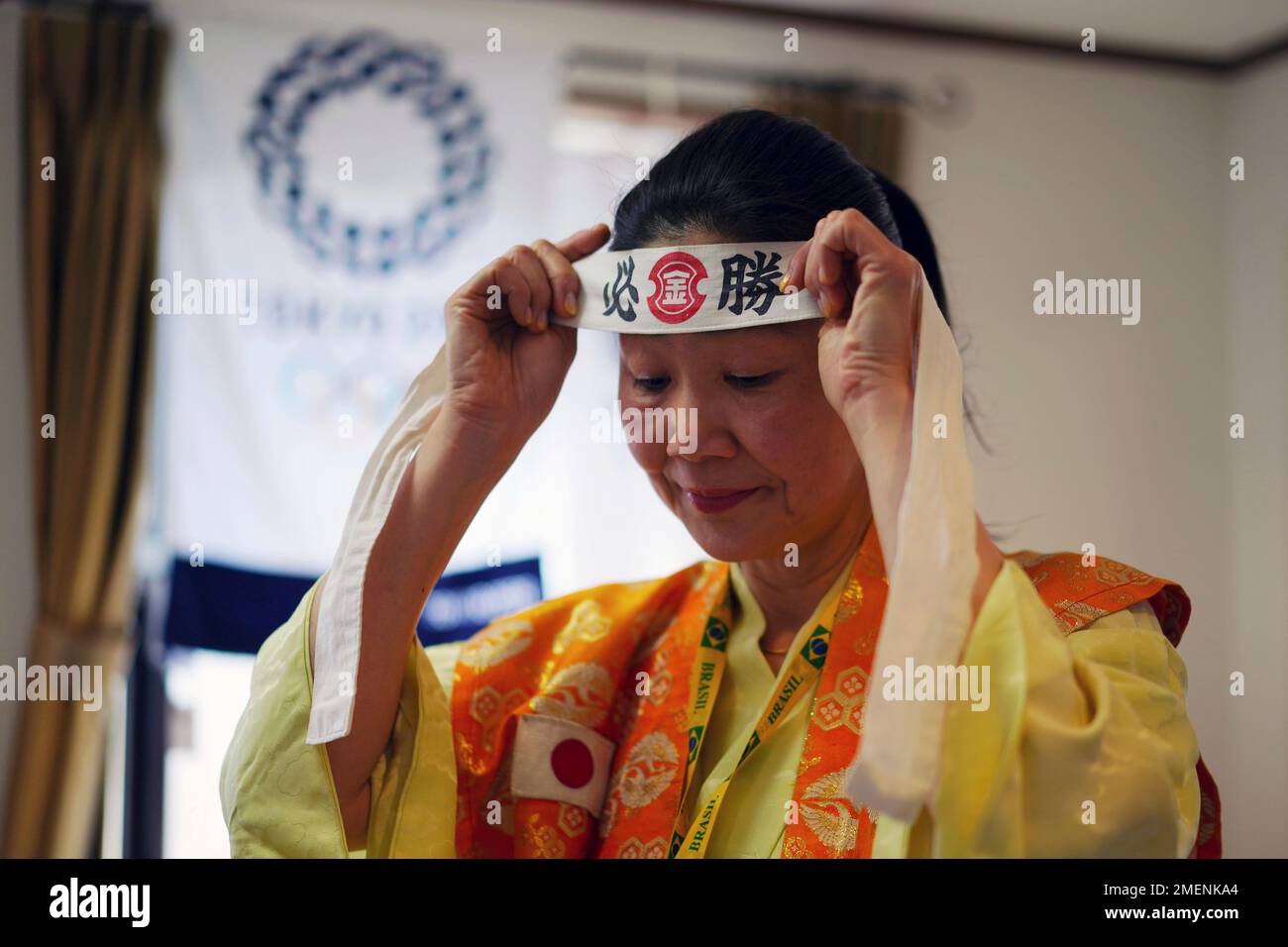 Olympic fan Kyoko Ishikawa wears a cheering headband with Japanese ...