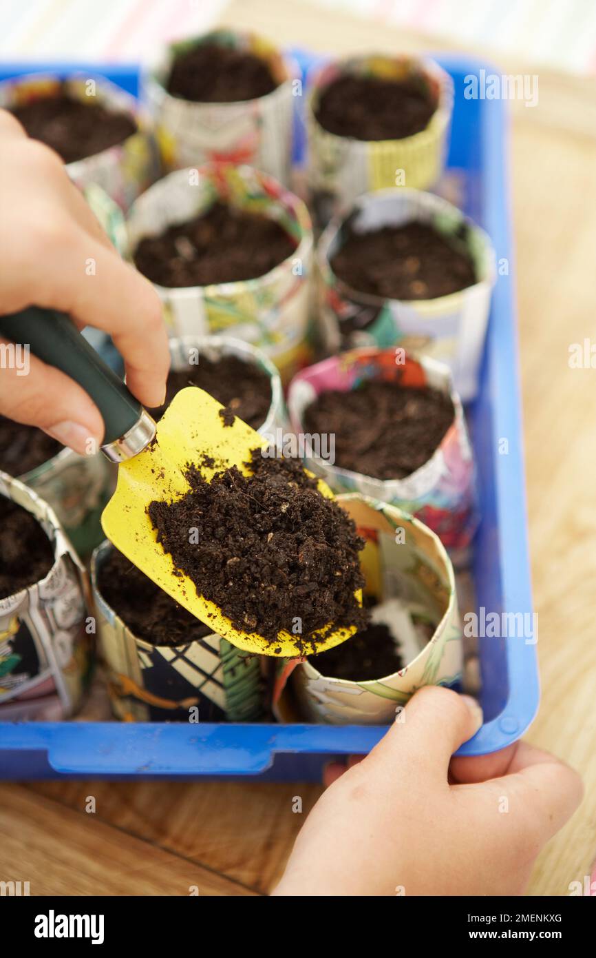 tray of creative pots filled with soil Stock Photo - Alamy