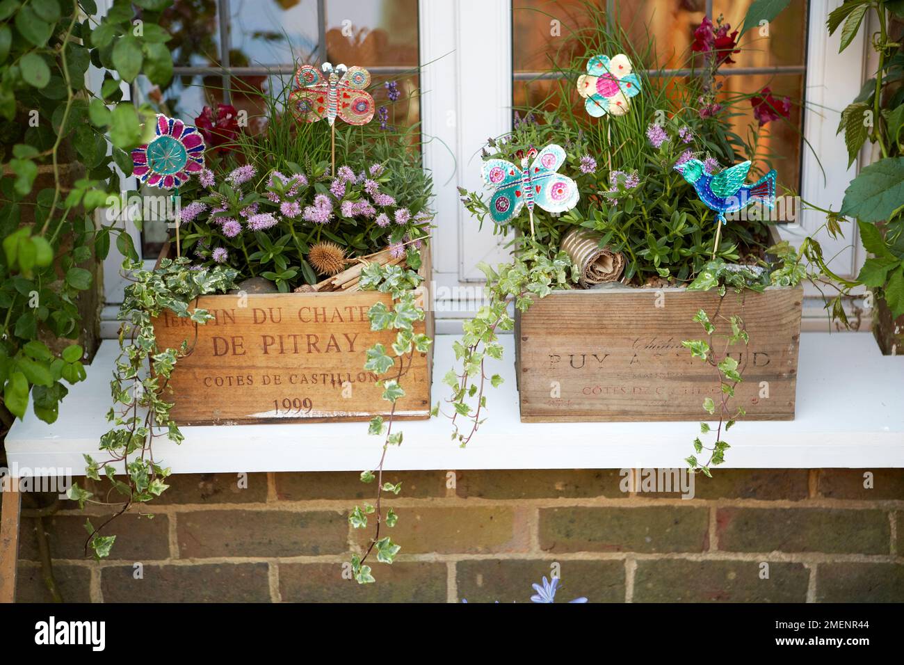 two wildlife windowboxes next to each other on windowsill Stock Photo ...
