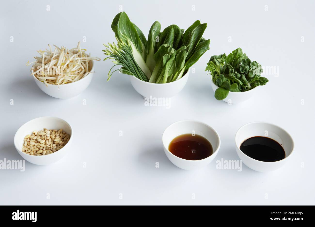 stir fry ingredients in white dishes only on white background Stock ...