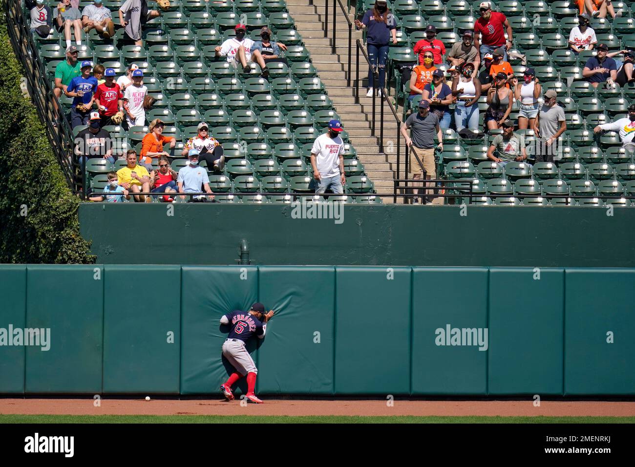 Boston Red Sox center fielder Enrique Hernandez hits the wall while ...