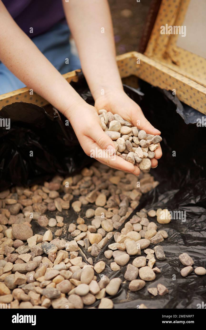 Child hands pebbles hi-res stock photography and images - Alamy