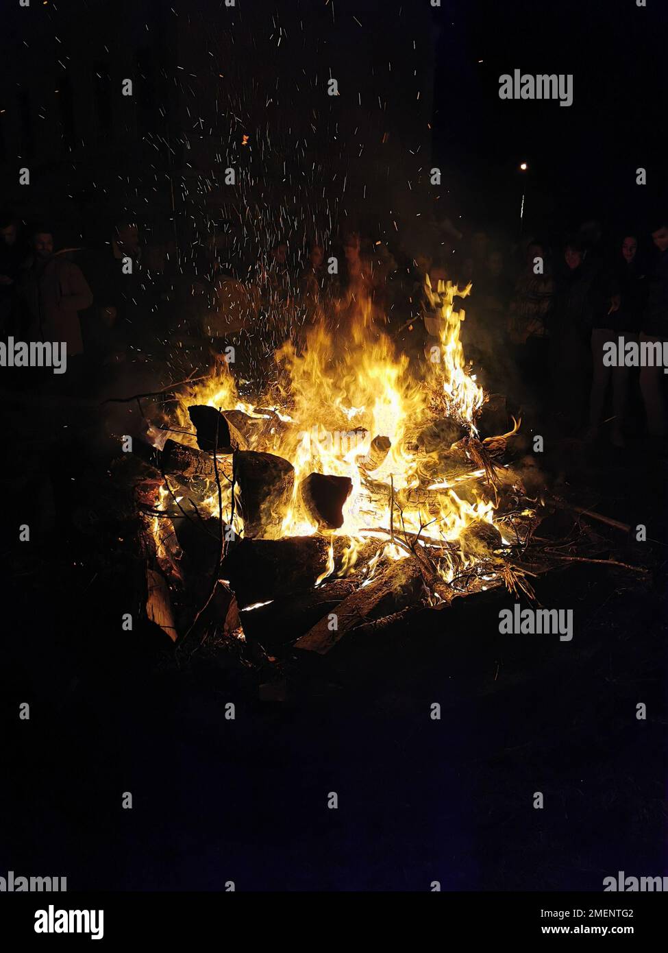 A vertical shot of a big bonfire at night Stock Photo - Alamy