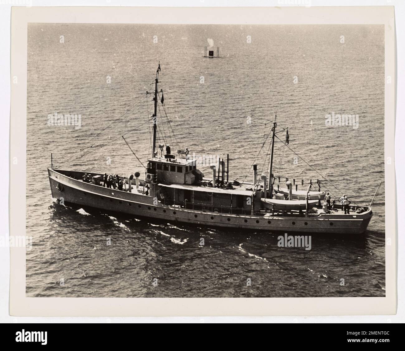 This image captures a Coast Guard ship engaged in target practice. Such ...