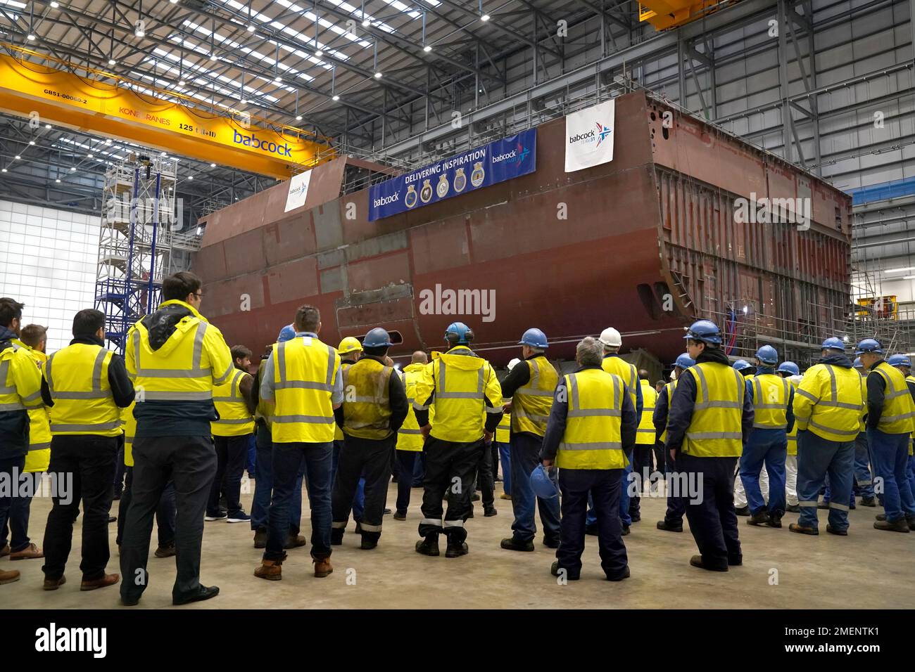 Workers look on at HMS Ventura in the Ventura building after a ceremony ...