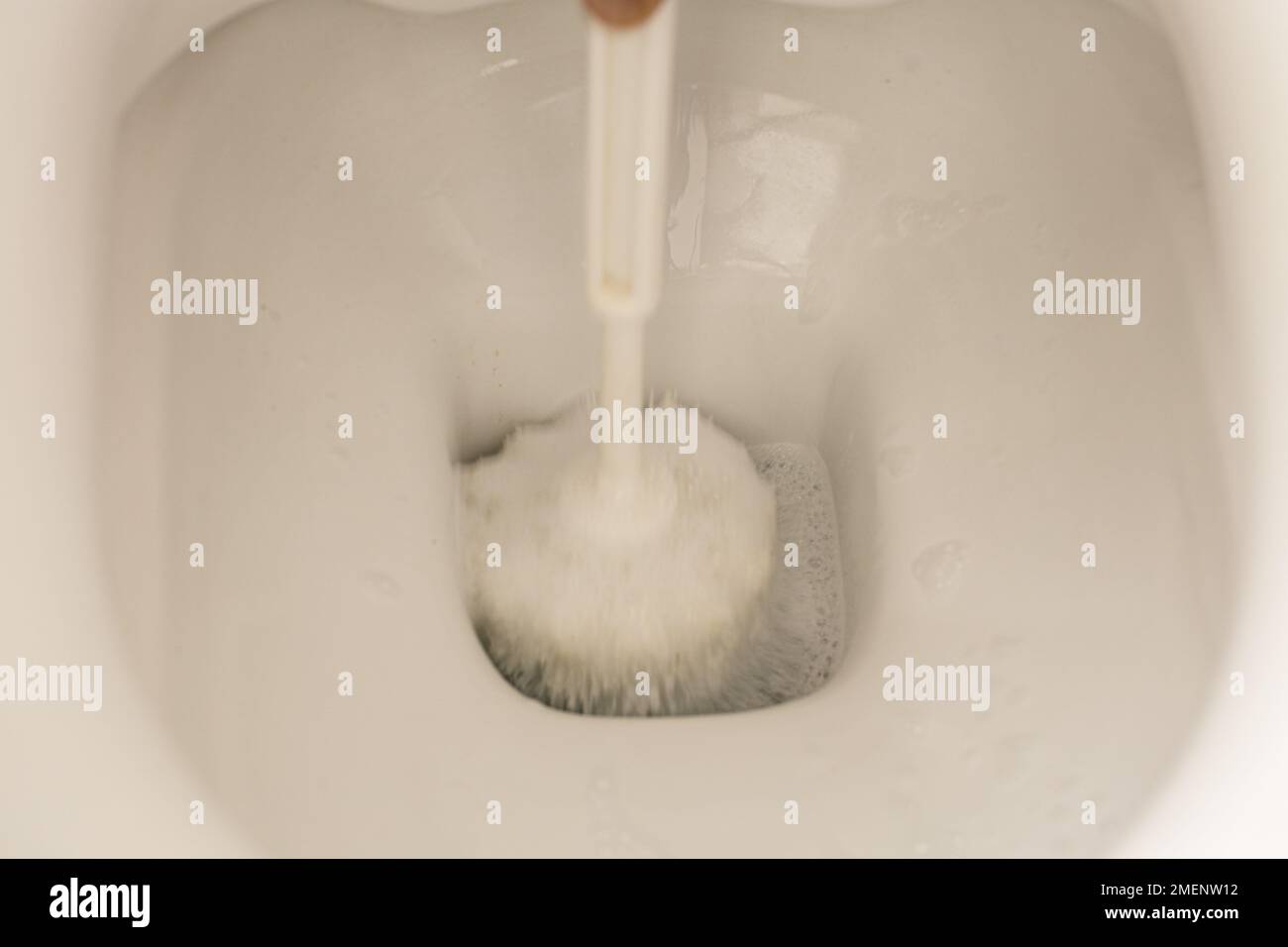 A dynamic image of a toilet brush effectively cleaning away dirt and ...