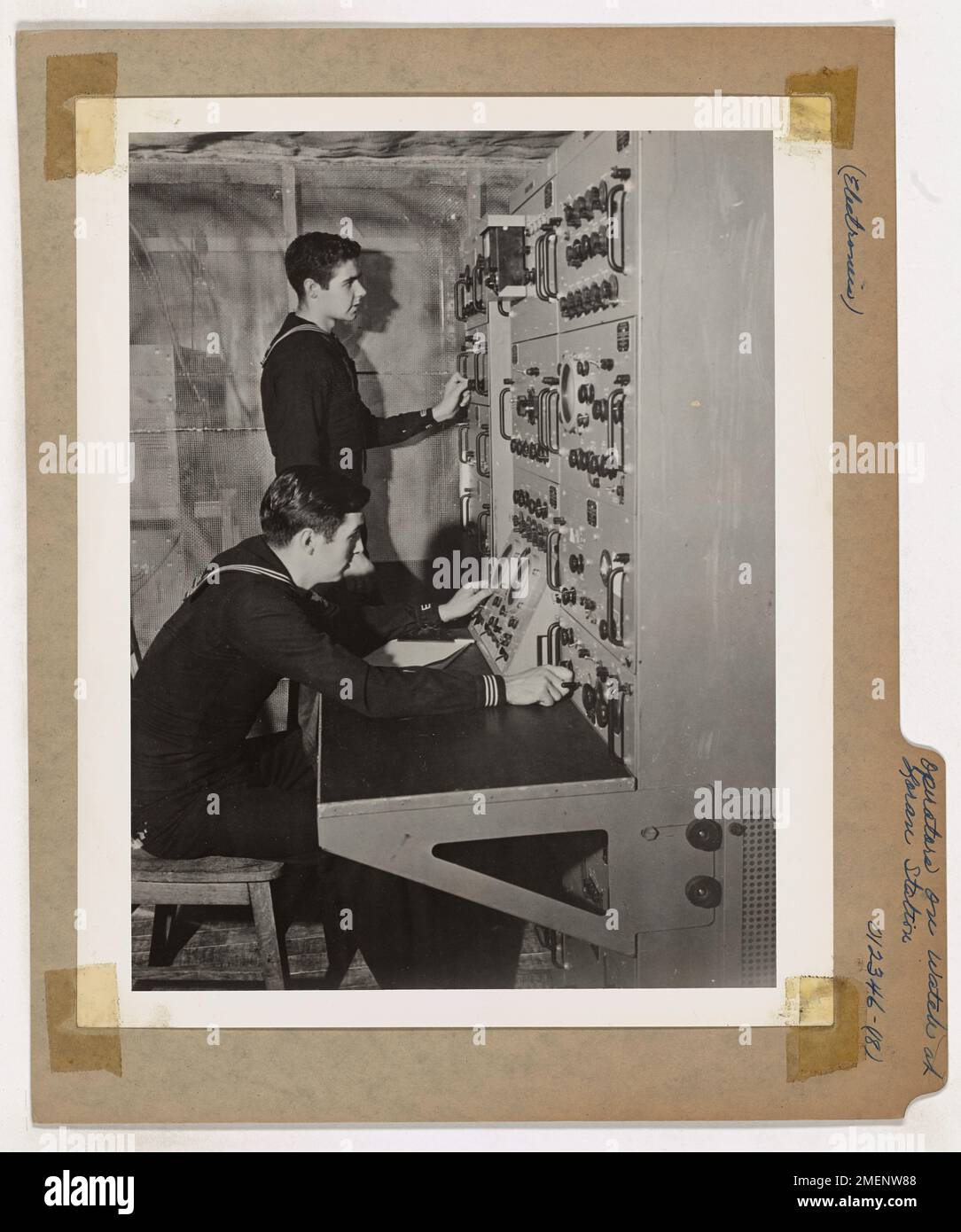 Operators on watch at a Loran station ensure the smooth functioning of ...