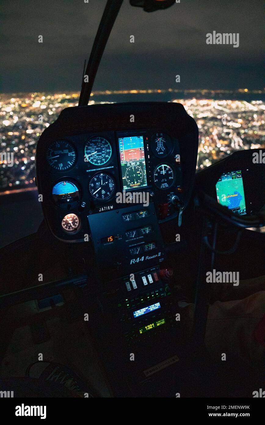 A vertical shot of the Tokyo cityscape seen from inside of a plane ...