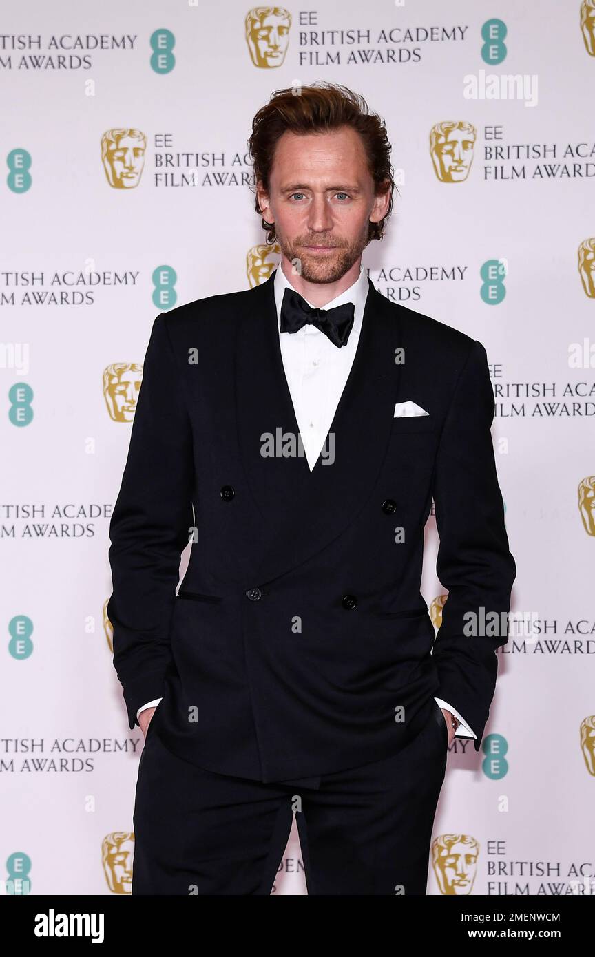 Actor Tom Hiddleston poses for photographers upon arrival at the Bafta ...
