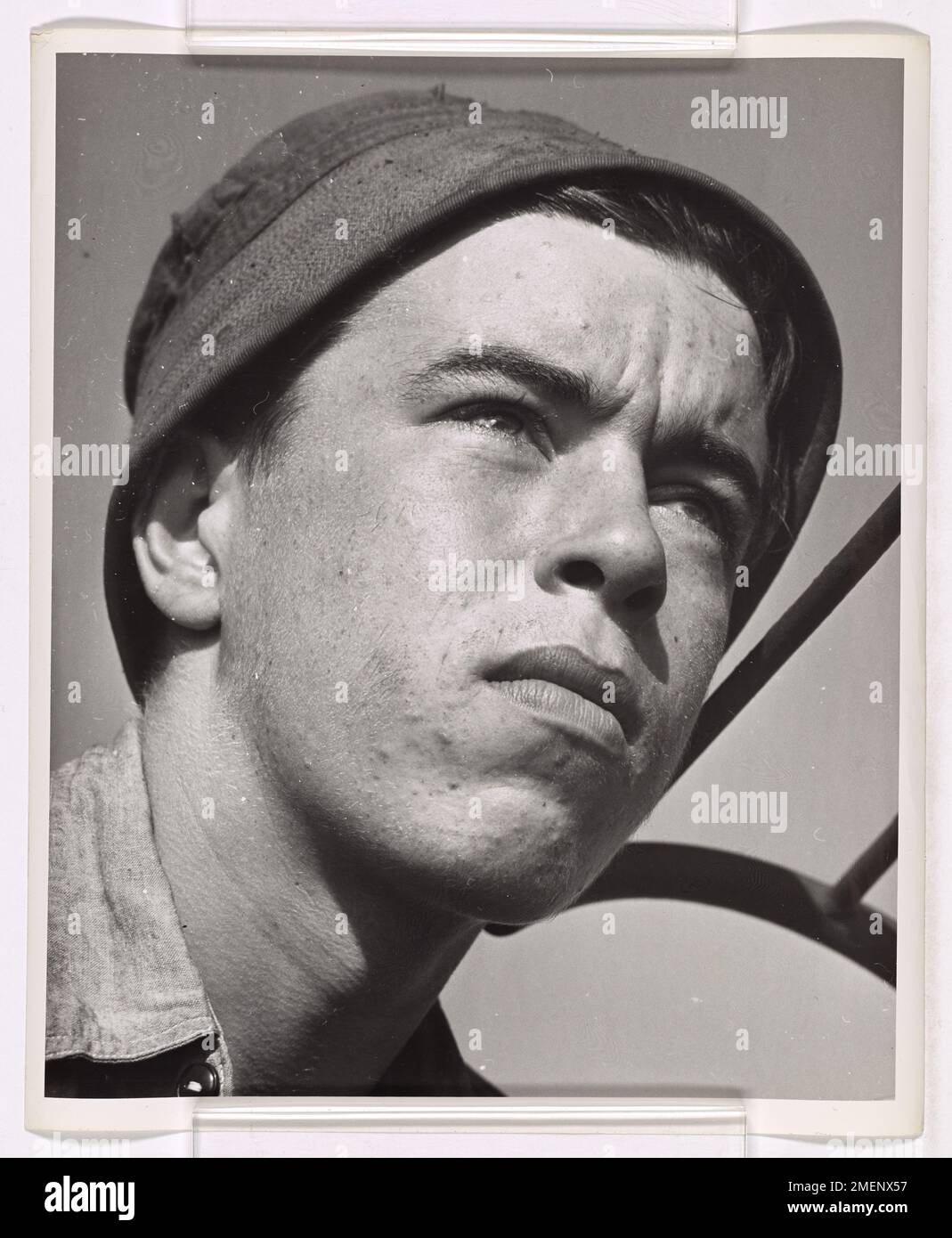 Coast Guardsman Paul L. McKeen operates a 40mm gun on a Coast Guard ...