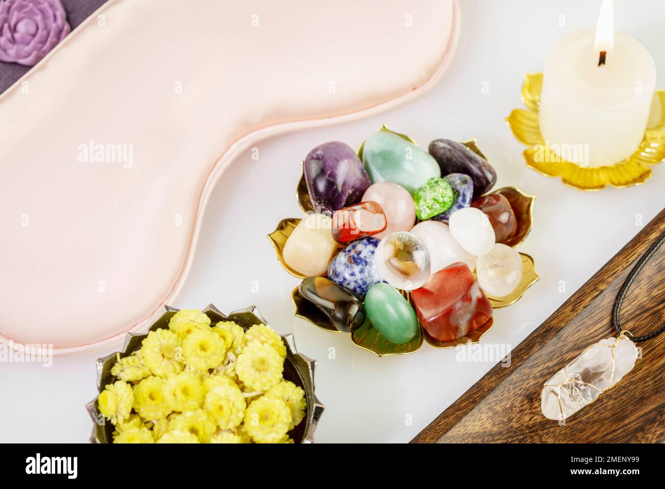 Relaxing ritual with crystals gemstones set, candle and sleep mask on ...