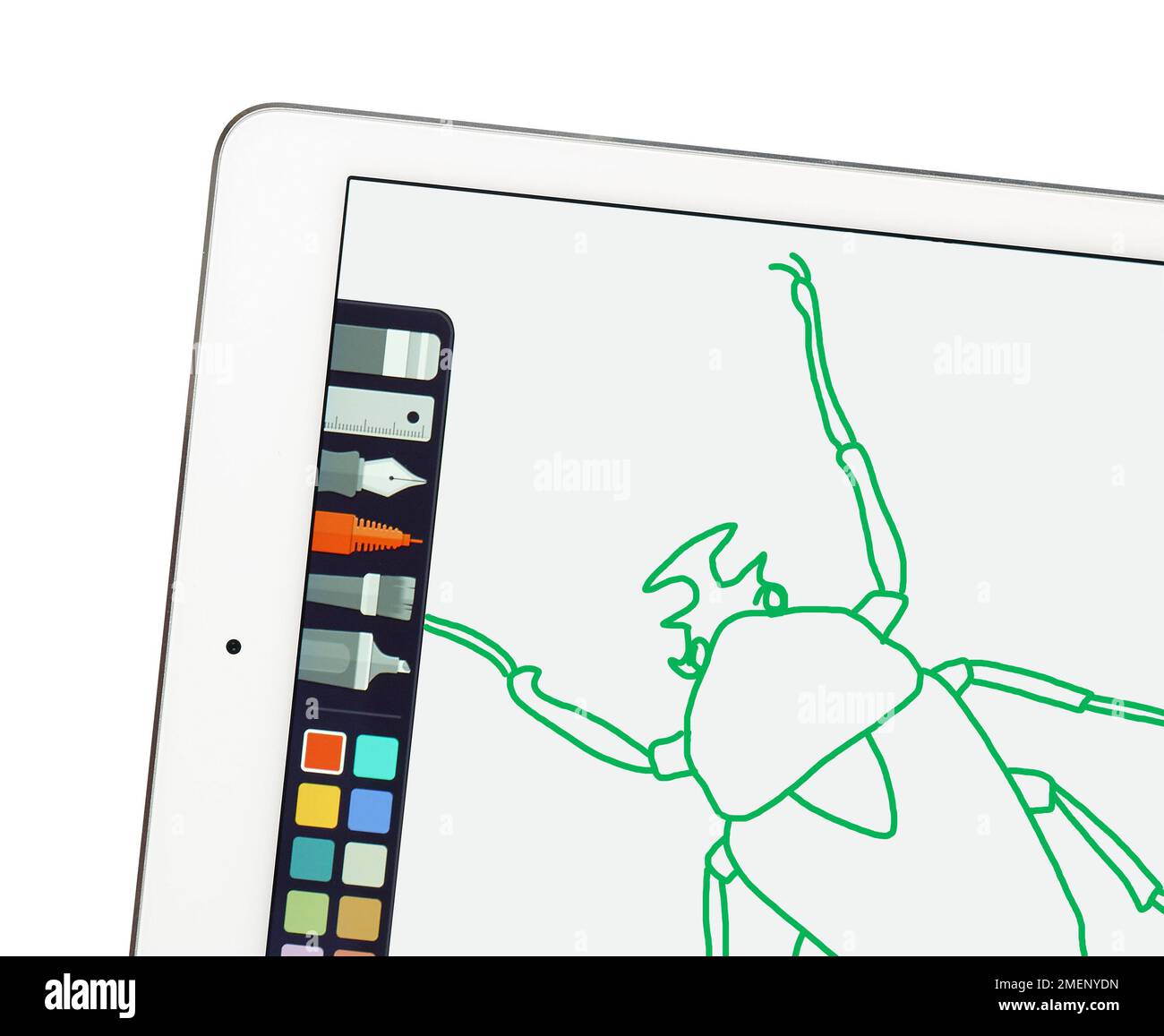Ipad with drawing tools and an outline of a beetle Stock Photo - Alamy