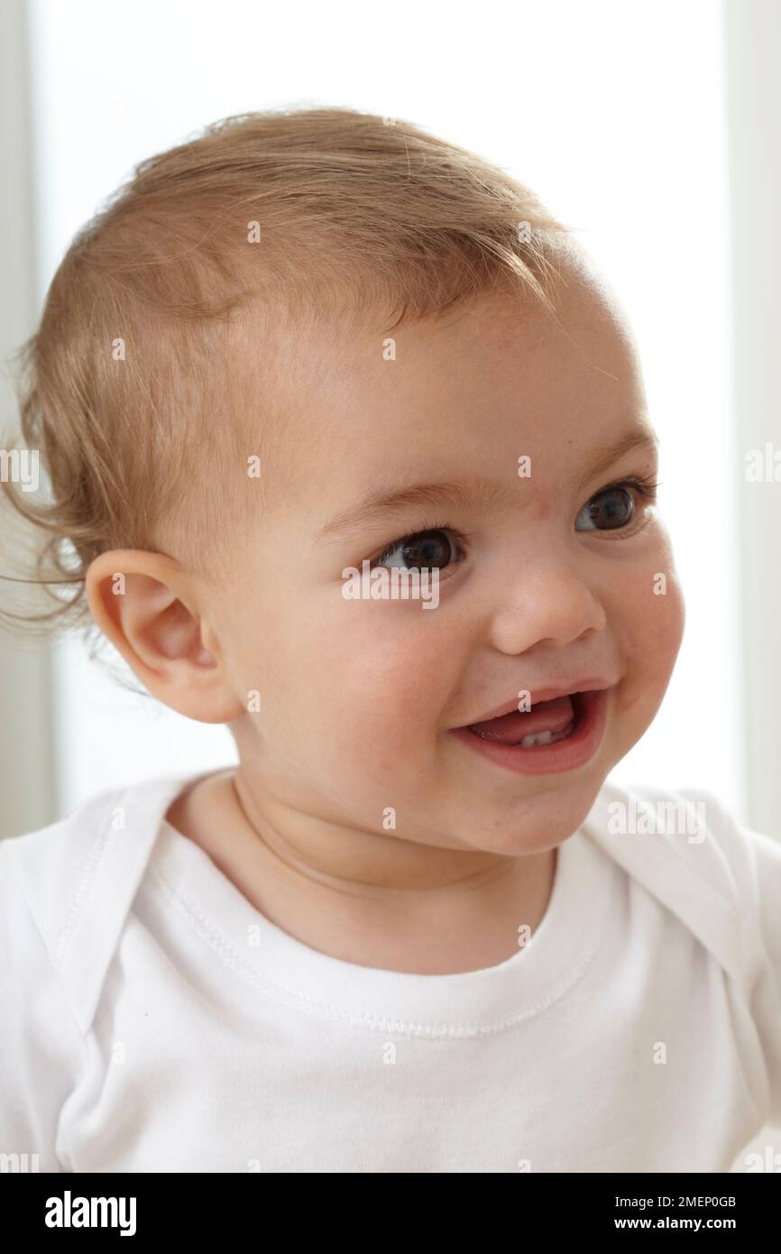 Smiling baby boy (46 weeks), close-up Stock Photo - Alamy