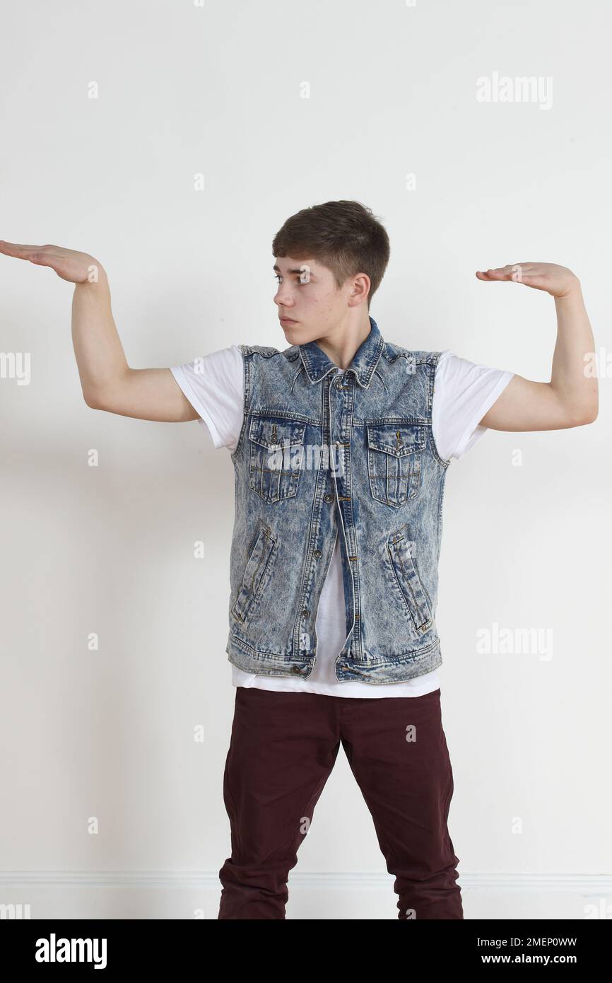 Teenage boy B-boying or breakdancing, Egyptian hand shapes (tutting ...