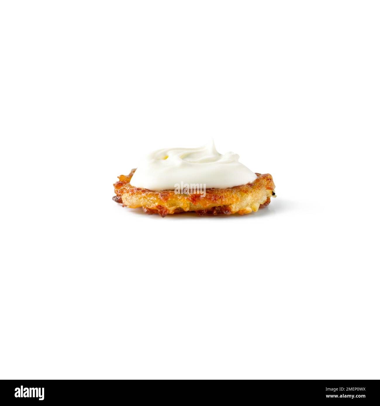 Sour cream on top of mini rosti Stock Photo - Alamy