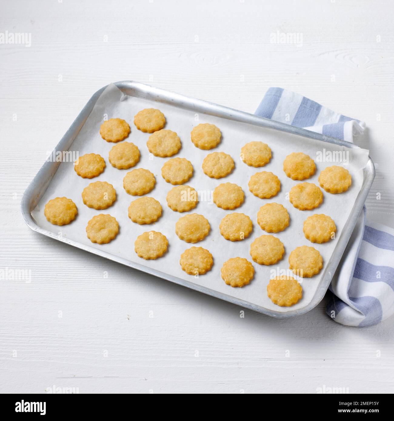 Baked parmesan shortbread canape bases on baking tray Stock Photo - Alamy