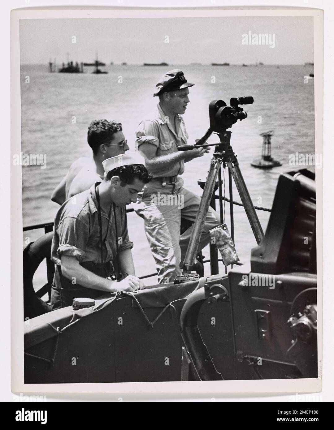 Coast Guard combat photographers John Folk and Gerald C. Anker capture ...