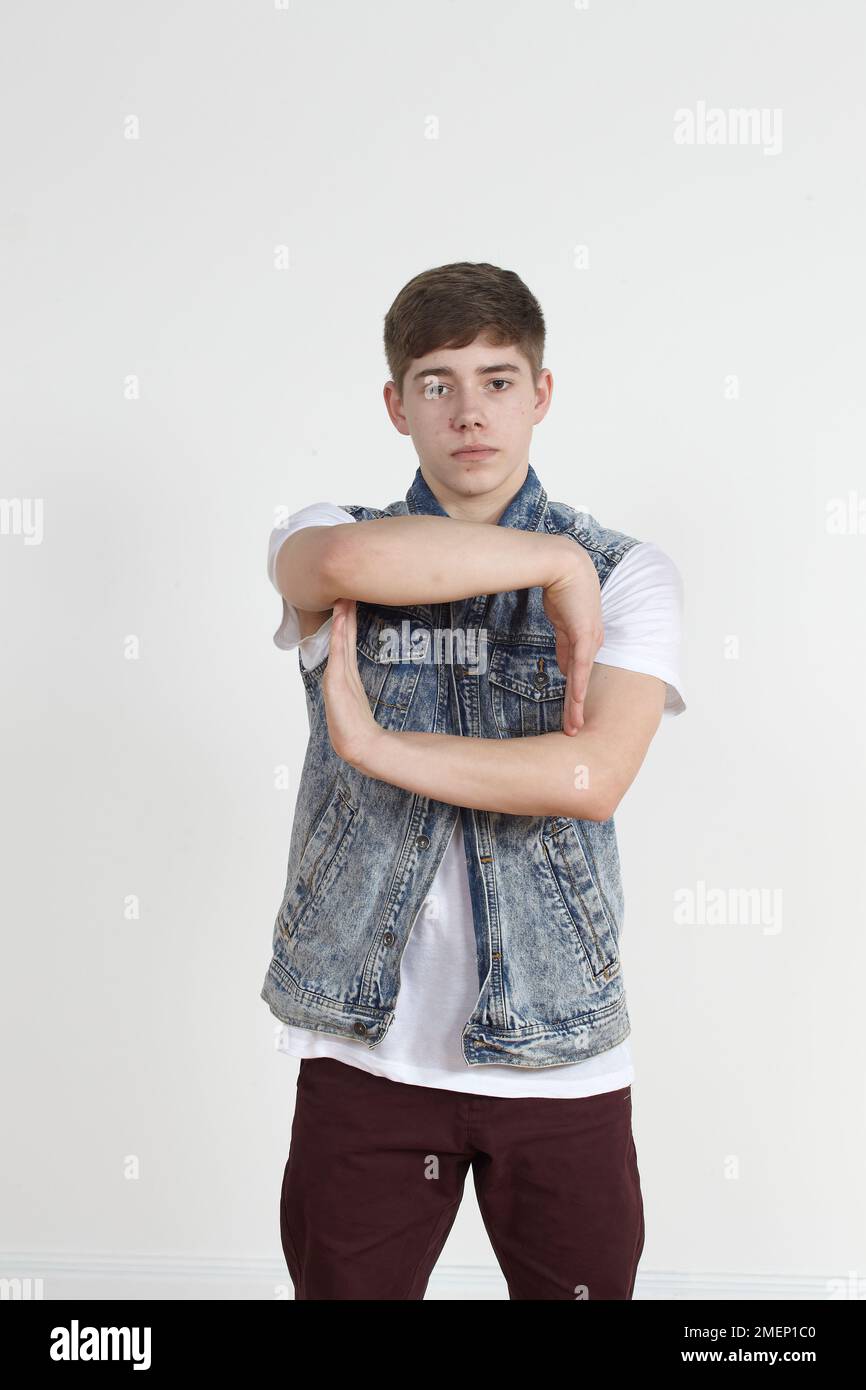 Teenage boy B-boying or breakdancing, Egyptian hand shapes (tutting ...