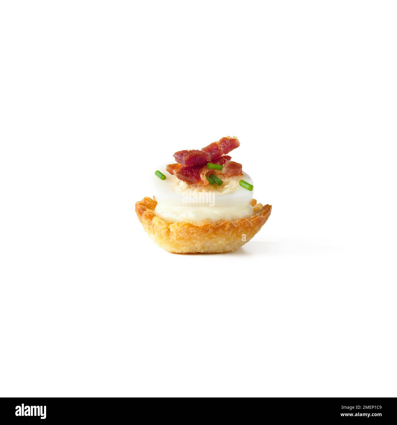 Boiled egg and crusted bacon croustade with chive, canape Stock Photo ...