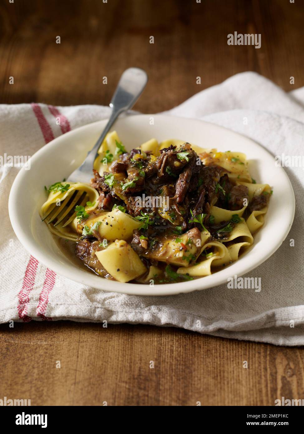 Braised oxtail served with pappardelle pasta Stock Photo - Alamy