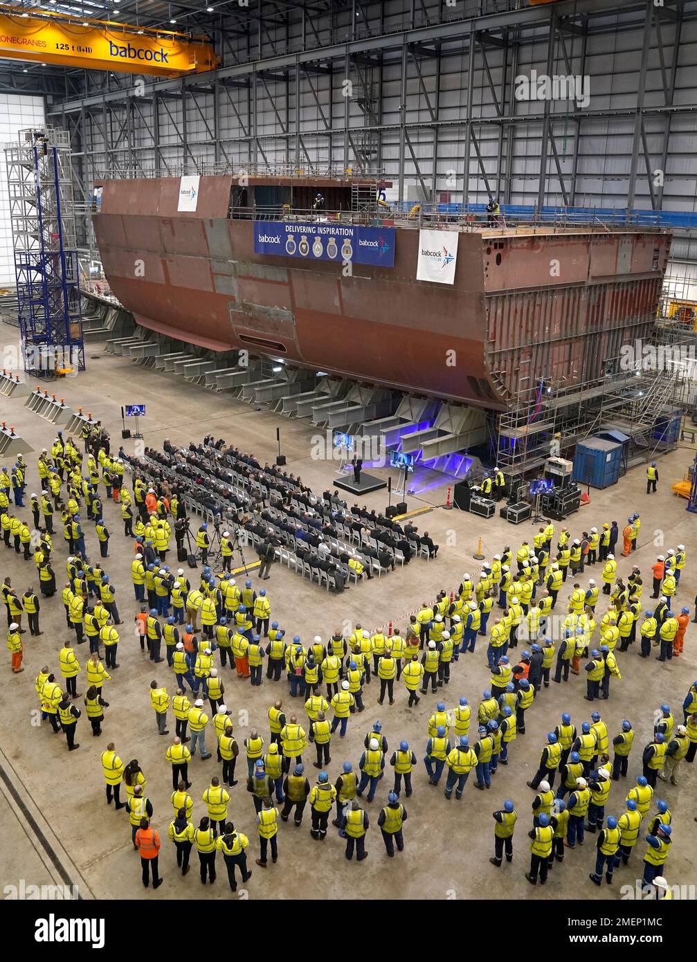 Workers look on at HMS Ventura in the Ventura building after a ceremony ...